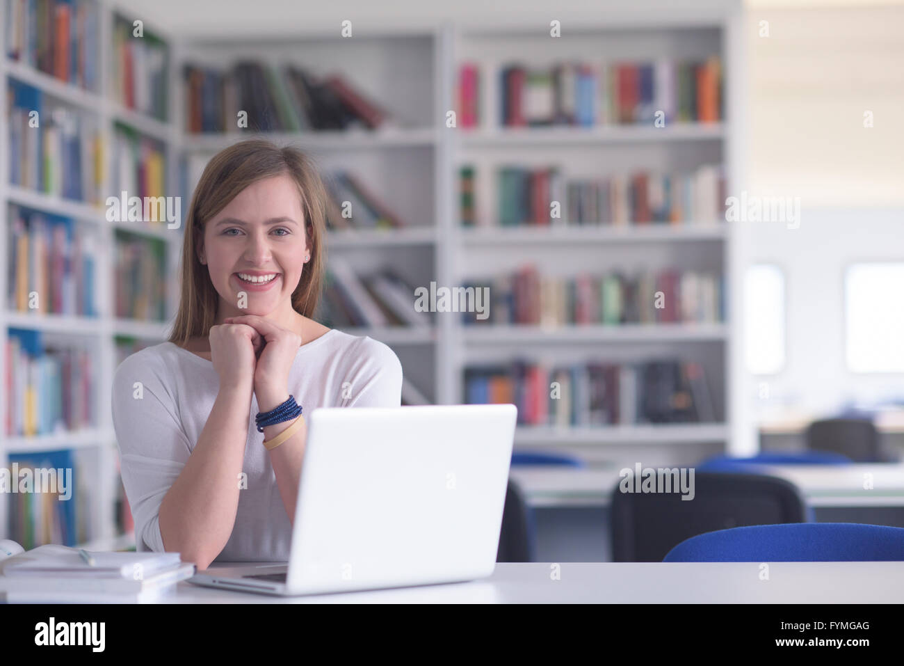 female student study in school library, using laptop and searching for ...