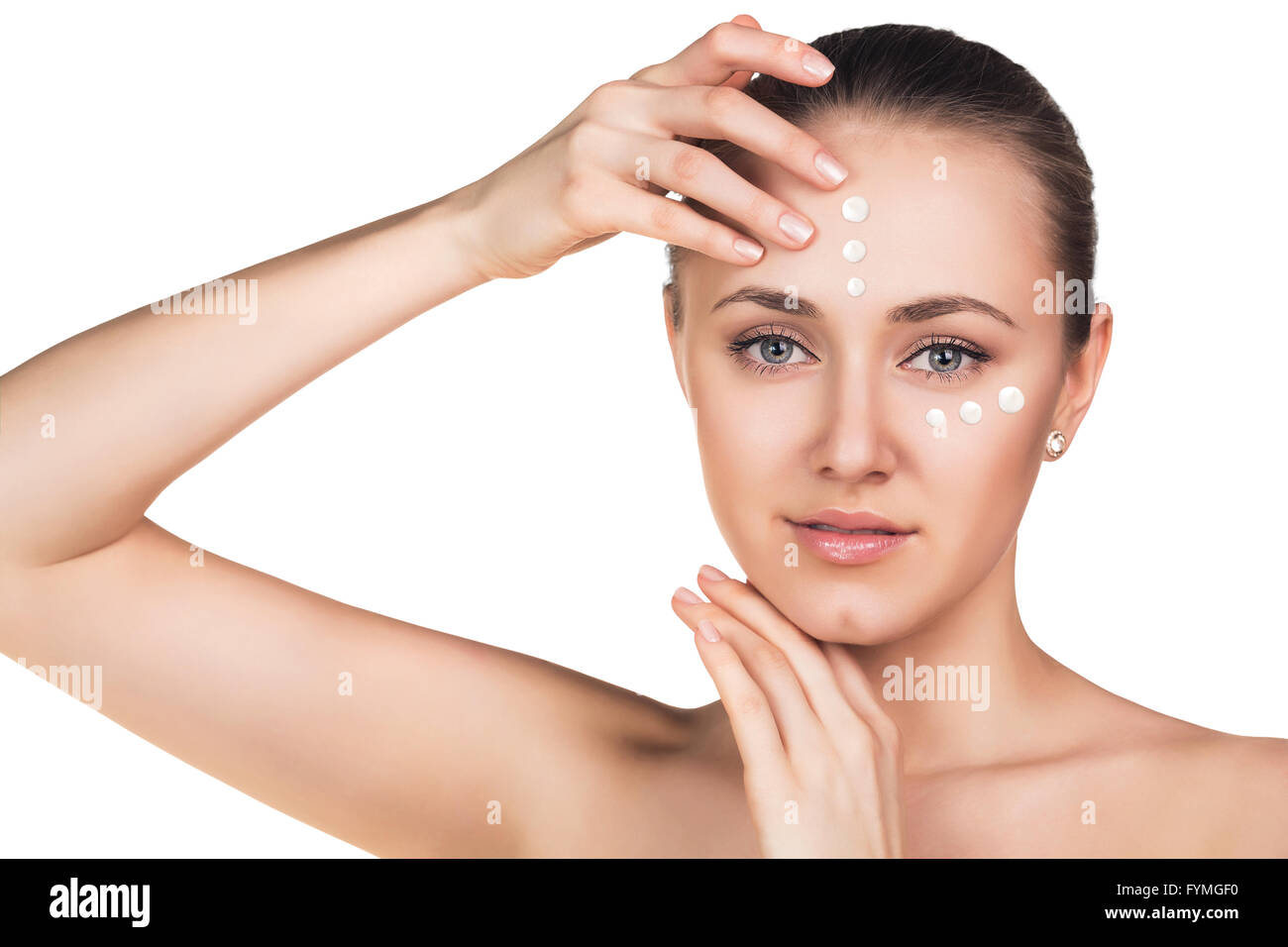 Girl with cream dots on face Stock Photo - Alamy