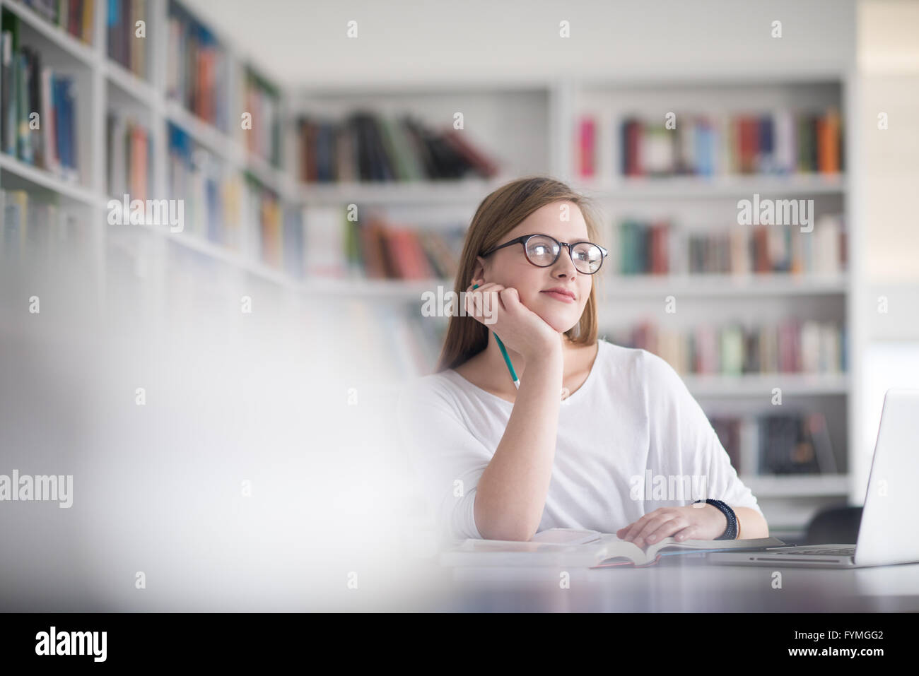 female student study in school library, using laptop and searching for ...