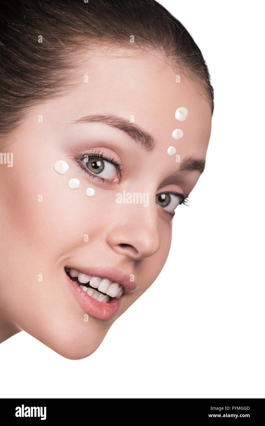 Girl with cream dots on face Stock Photo - Alamy