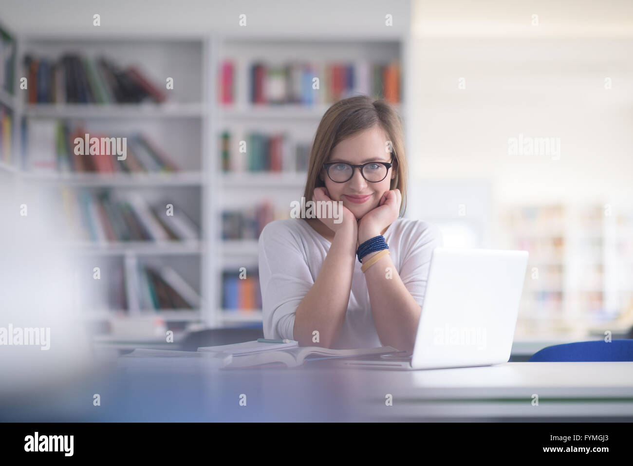 female student study in school library, using laptop and searching for ...