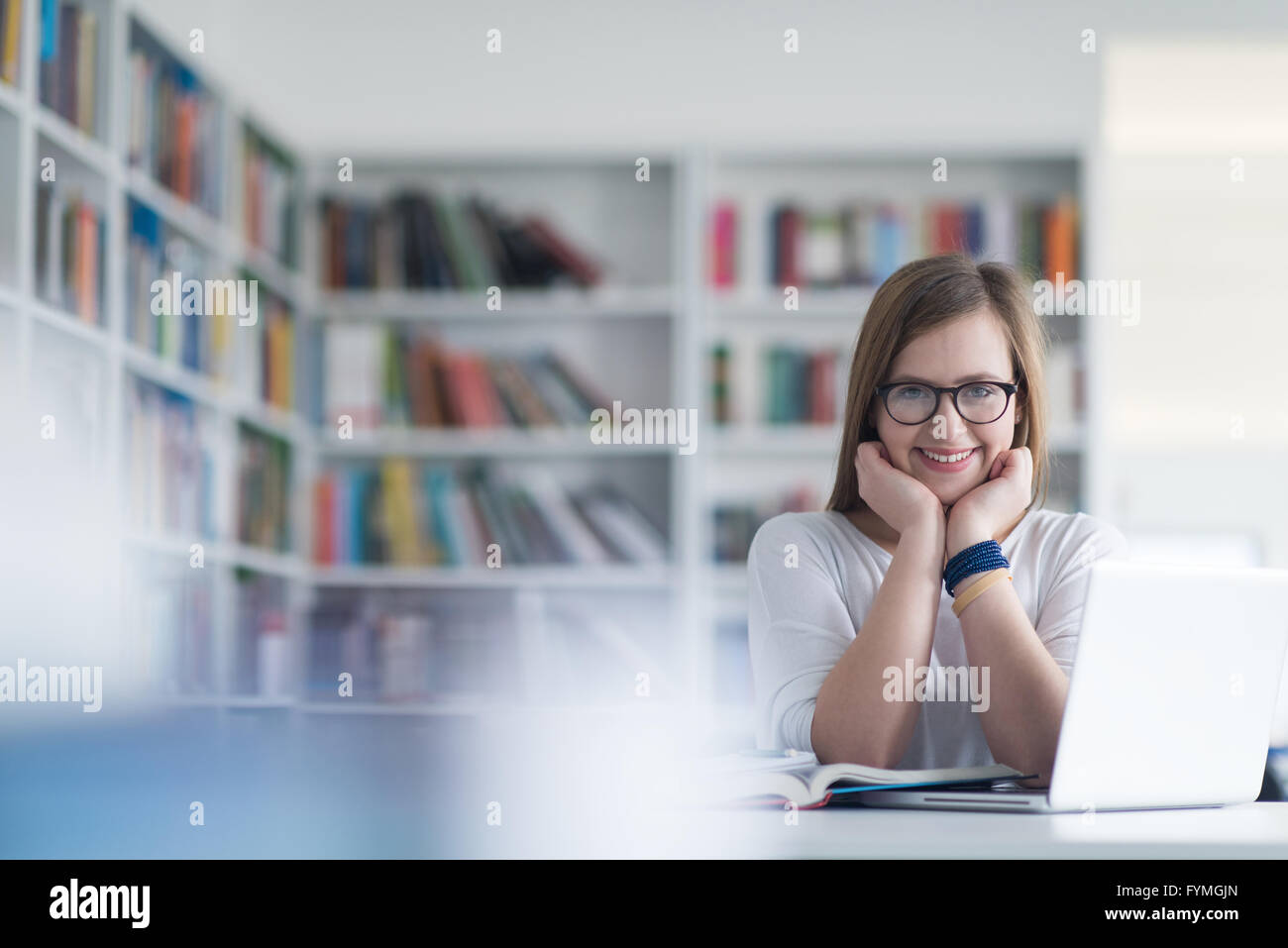 female student study in school library, using laptop and searching for ...