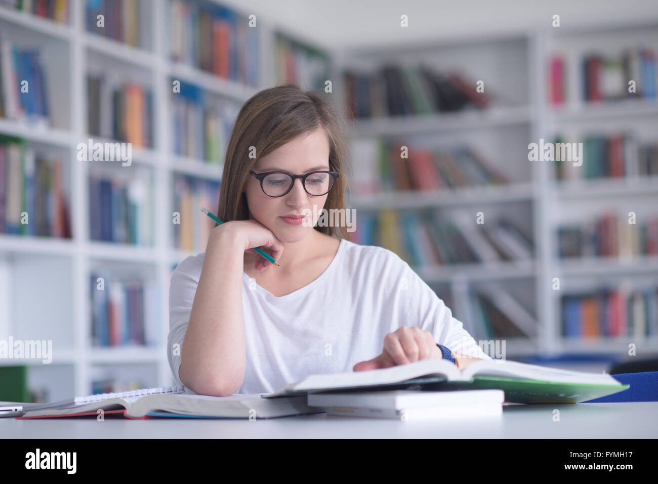 female student study in school library, using laptop and searching for ...