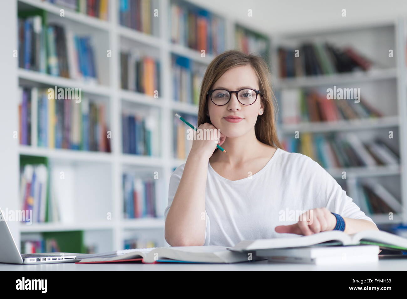 female student study in school library, using laptop and searching for ...