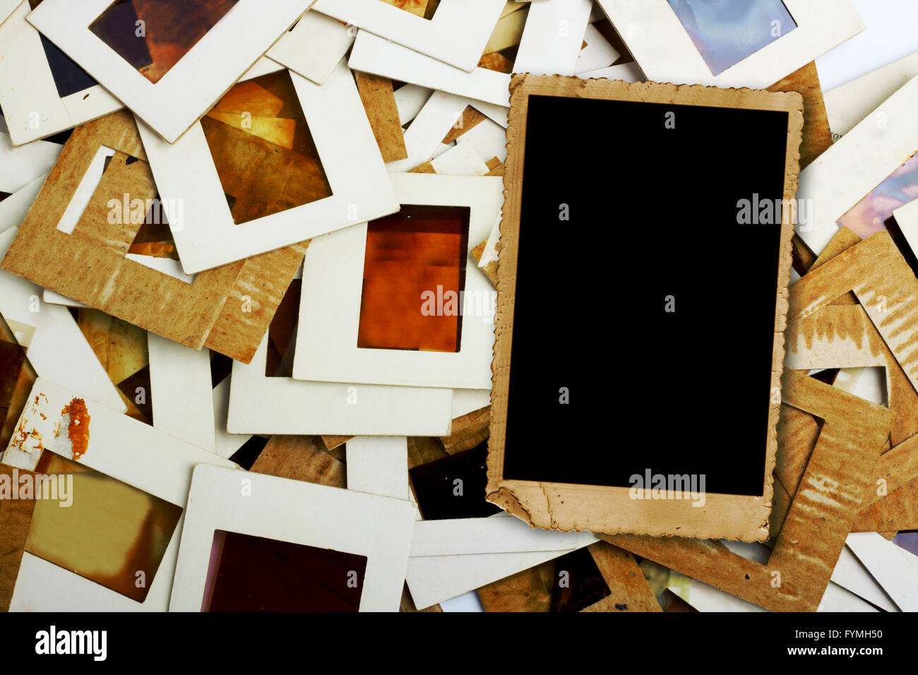 Set of old slides, photos and film on the table Stock Photo - Alamy