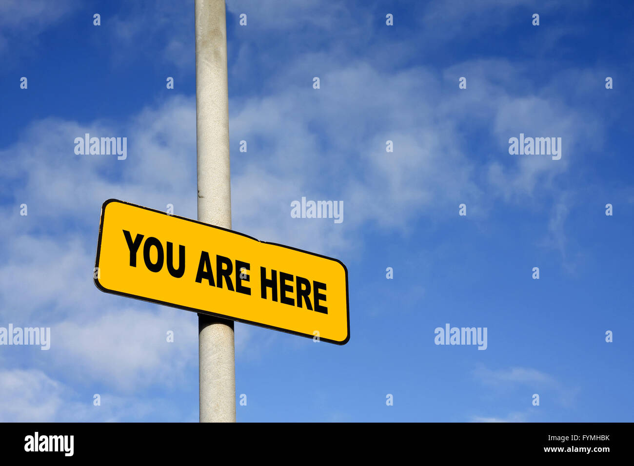 Yellow You Are Here sign Stock Photo - Alamy