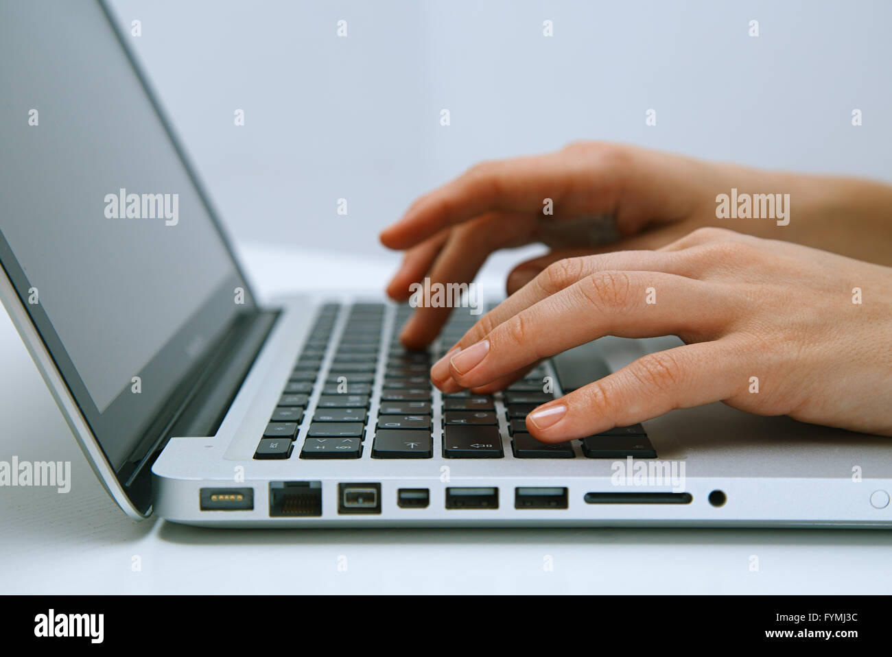 Working on laptop Stock Photo - Alamy