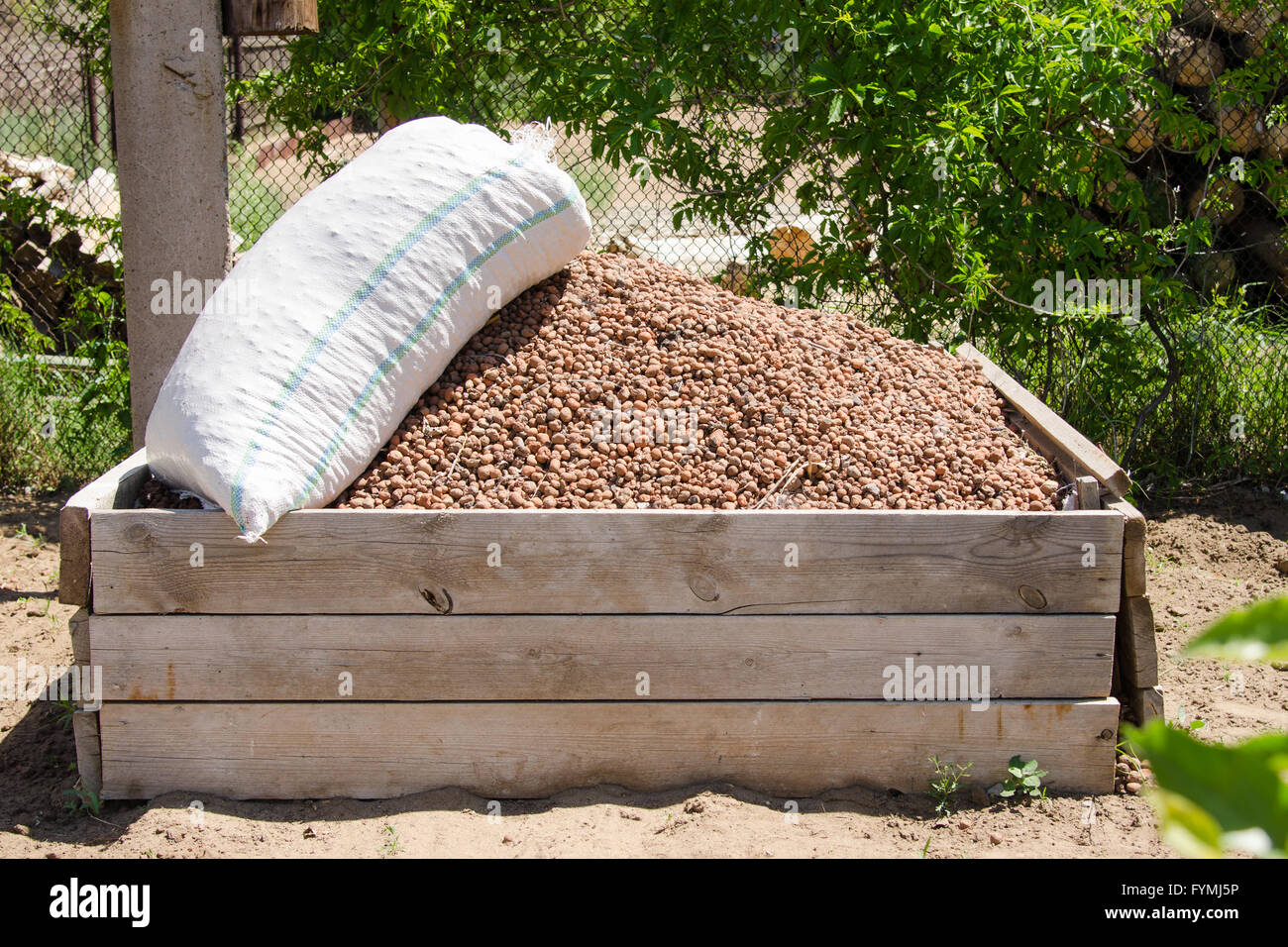 bunch of expanded clay in a wooden box Stock Photo - Alamy