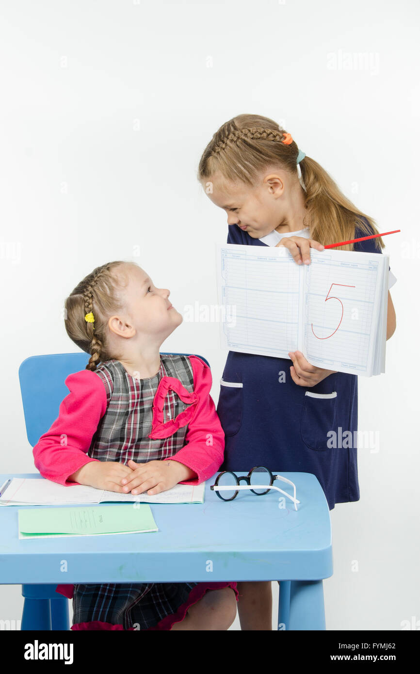 The teacher has put the five student Stock Photo - Alamy