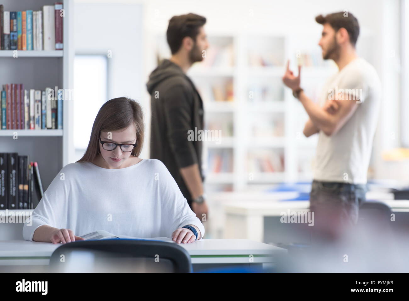 female smart looking student study in school library, group of students ...