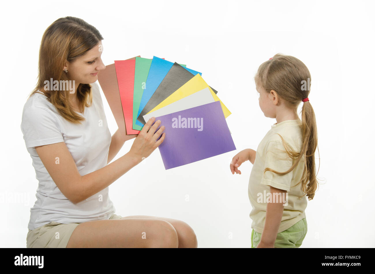 Girl finds it difficult to pick the color Stock Photo - Alamy