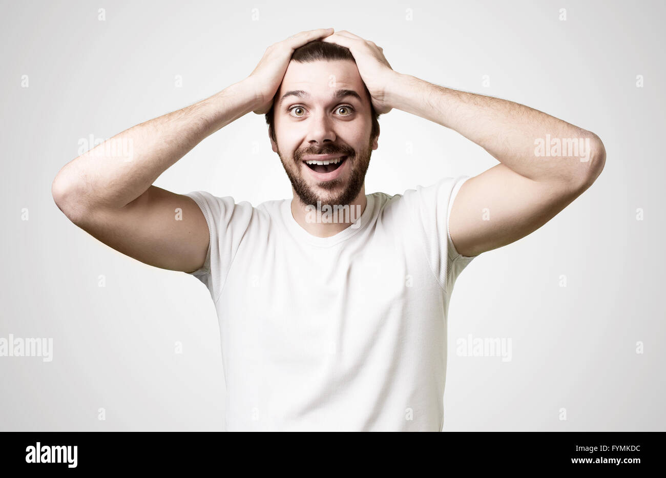 portrait of a young beautiful man surprised Stock Photo - Alamy