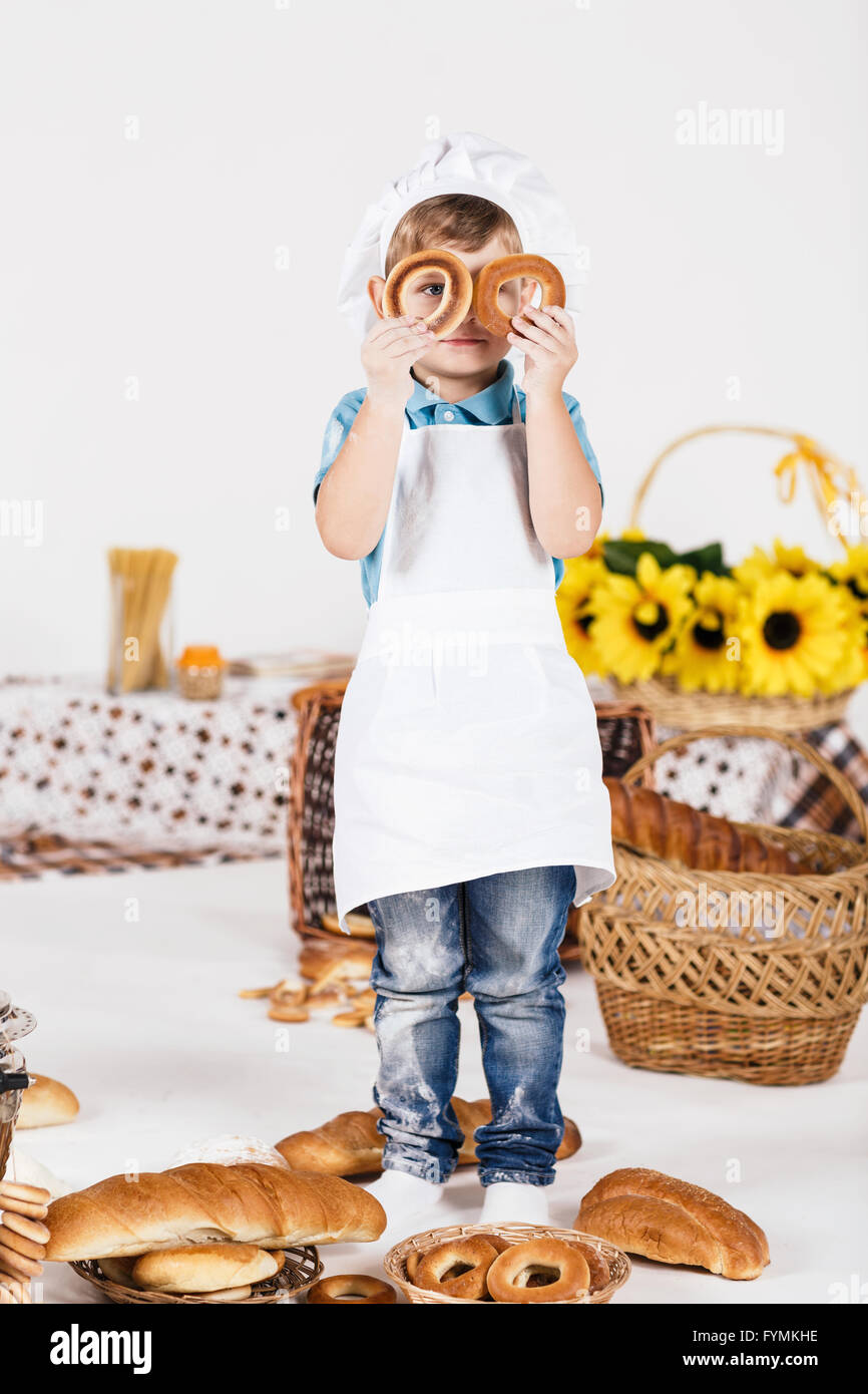 Boy chef cooking in the kitchen Stock Photo - Alamy