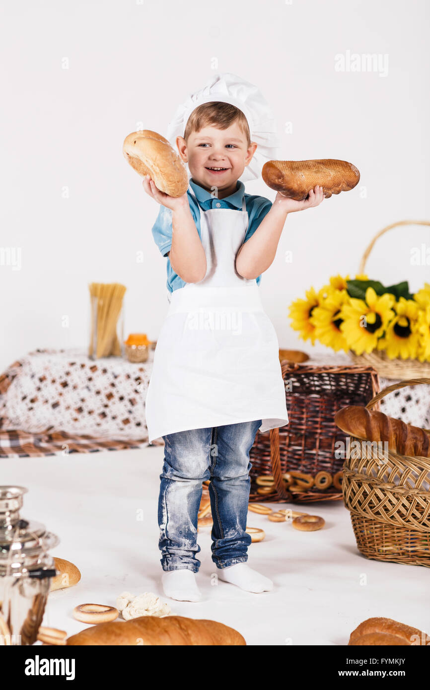 Boy chef cooking in the kitchen Stock Photo - Alamy