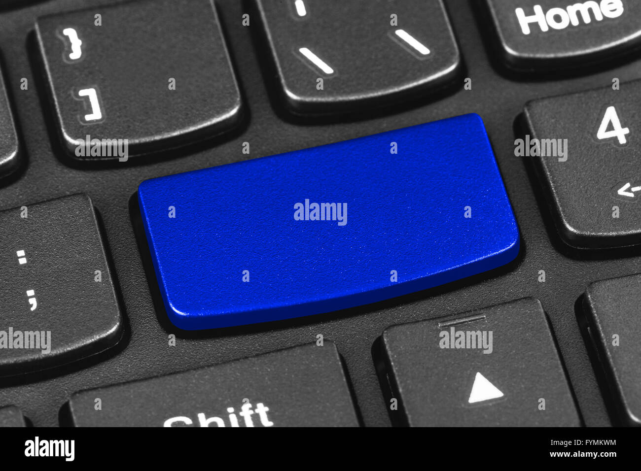Computer notebook keyboard with blank blue key Stock Photo - Alamy