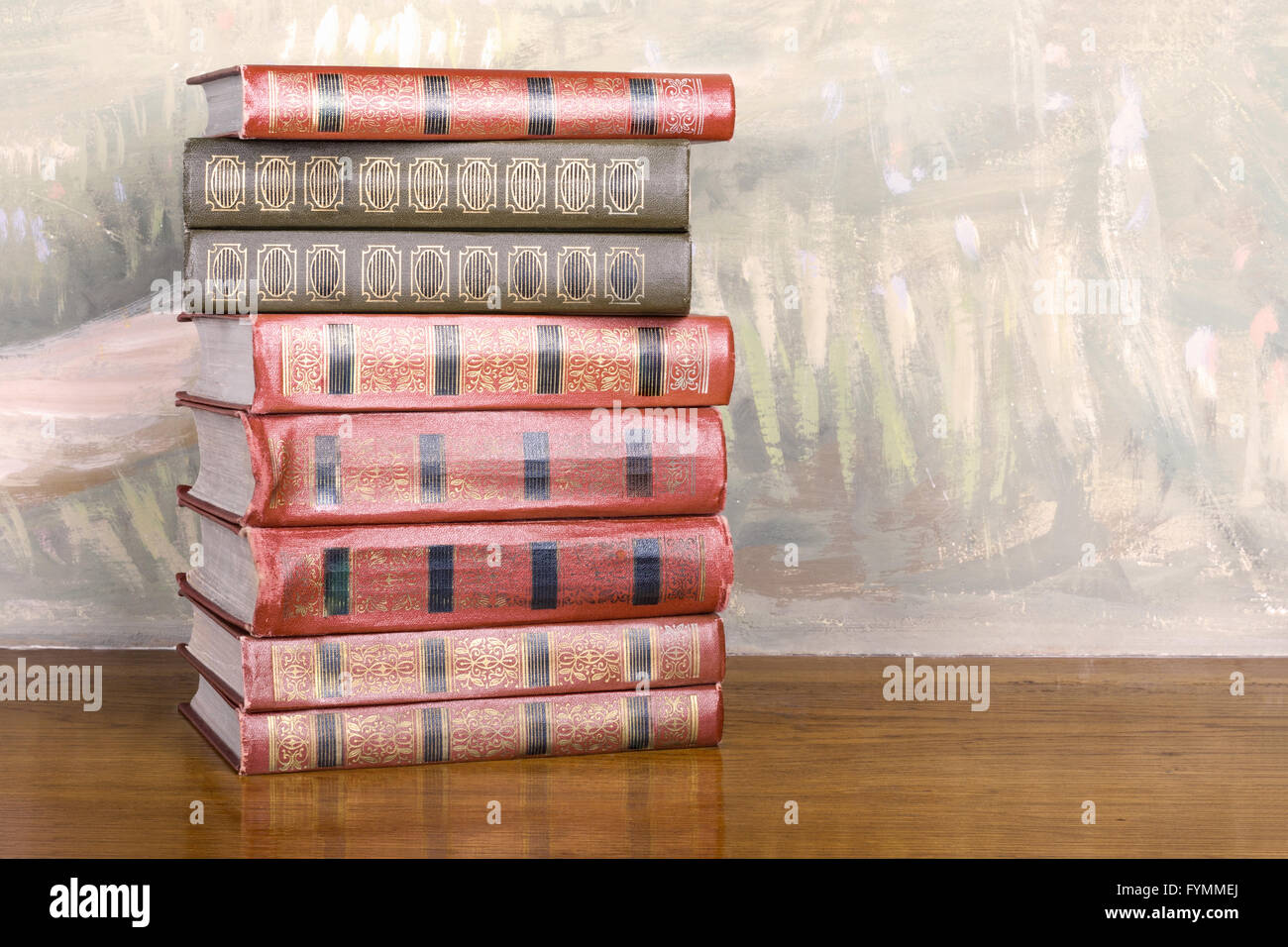 Richly decorated volumes of books with gold lettering Stock Photo - Alamy