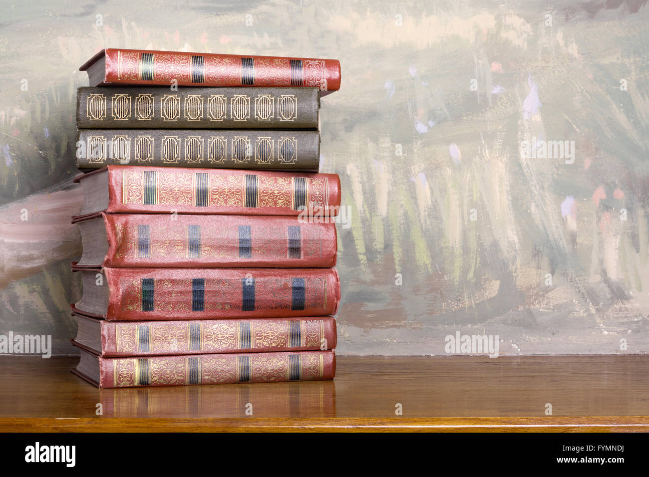 Richly decorated volumes of books with gold lettering Stock Photo - Alamy