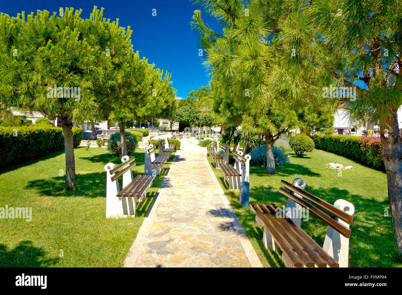 Mediterranean park with benches view Stock Photo - Alamy