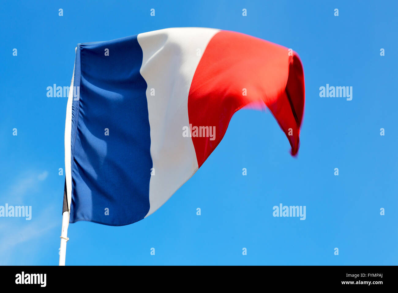 french waving flag in the blue sky france wave Stock Photo - Alamy