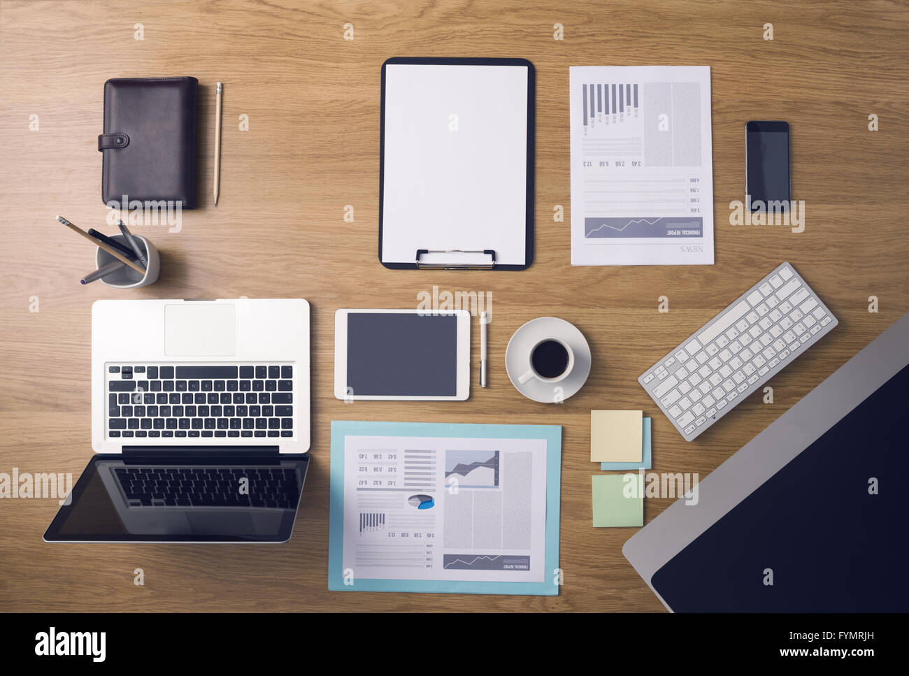 Businessman's tidy desktop and work tools with paperwork, computer ...