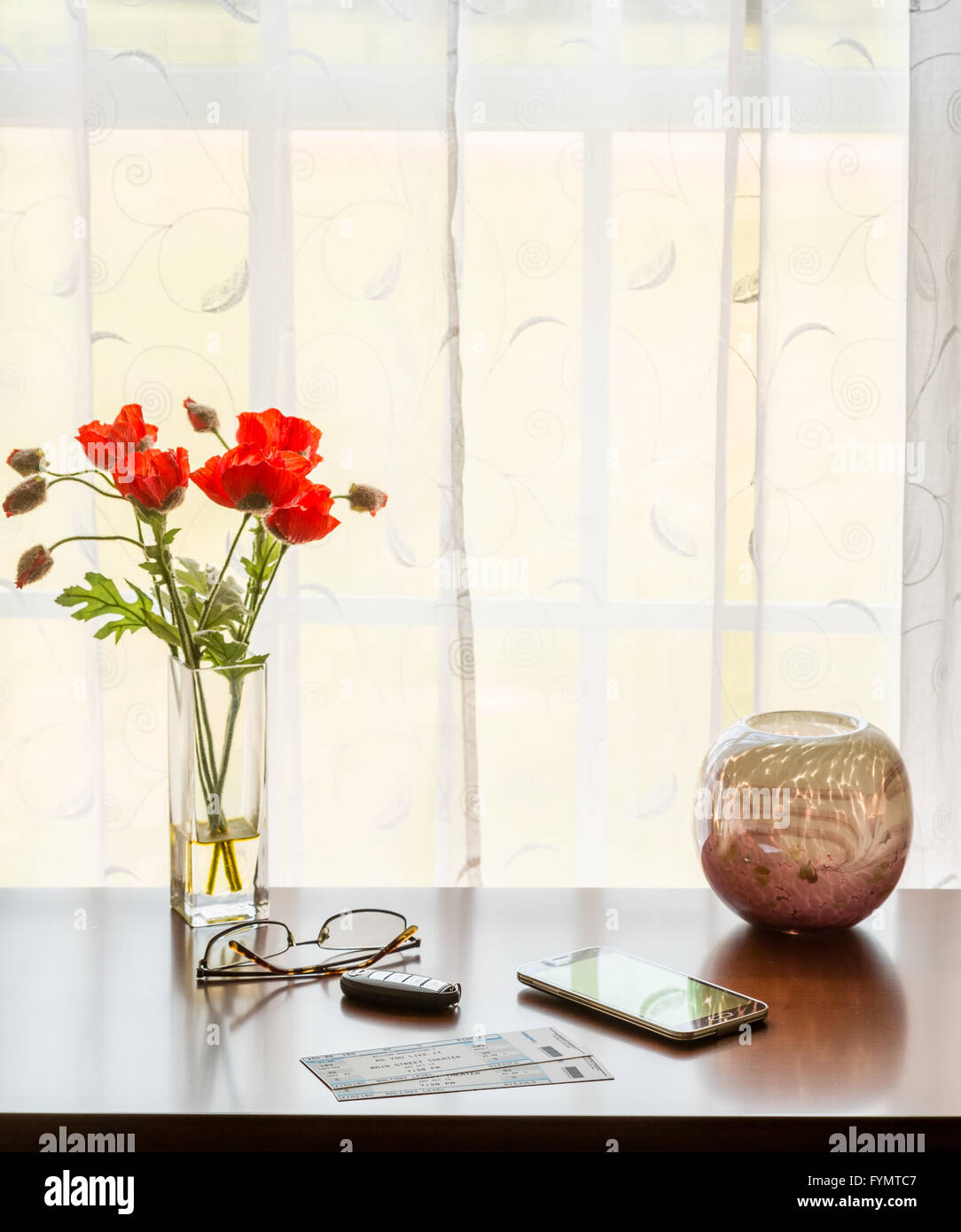 Pair of theater tickets on table with window Stock Photo - Alamy