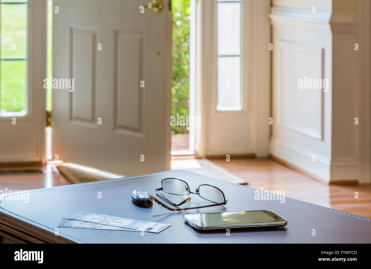 Pair of theater tickets on table with front door Stock Photo - Alamy