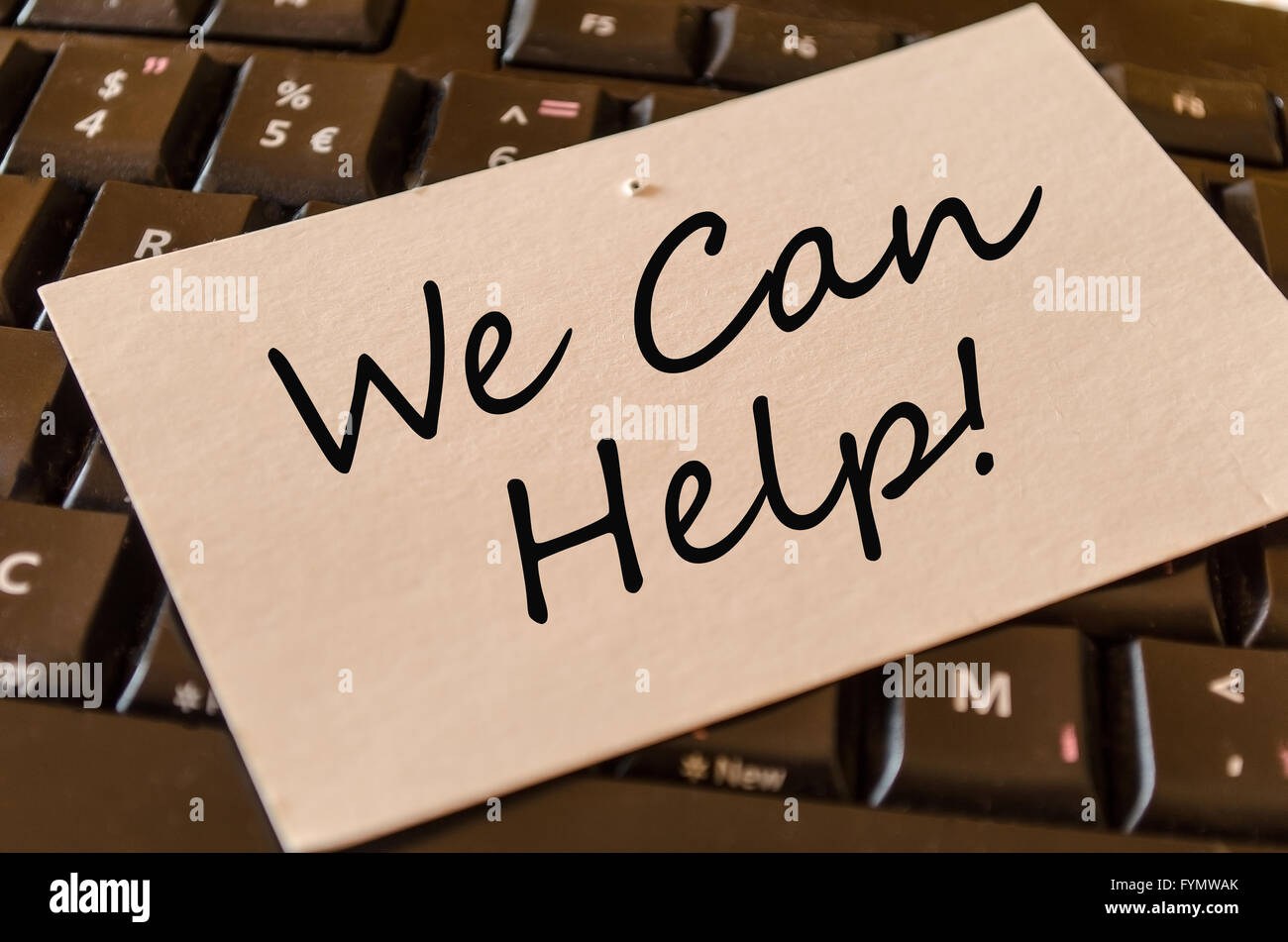 We can help Concept on keyboard note Stock Photo - Alamy