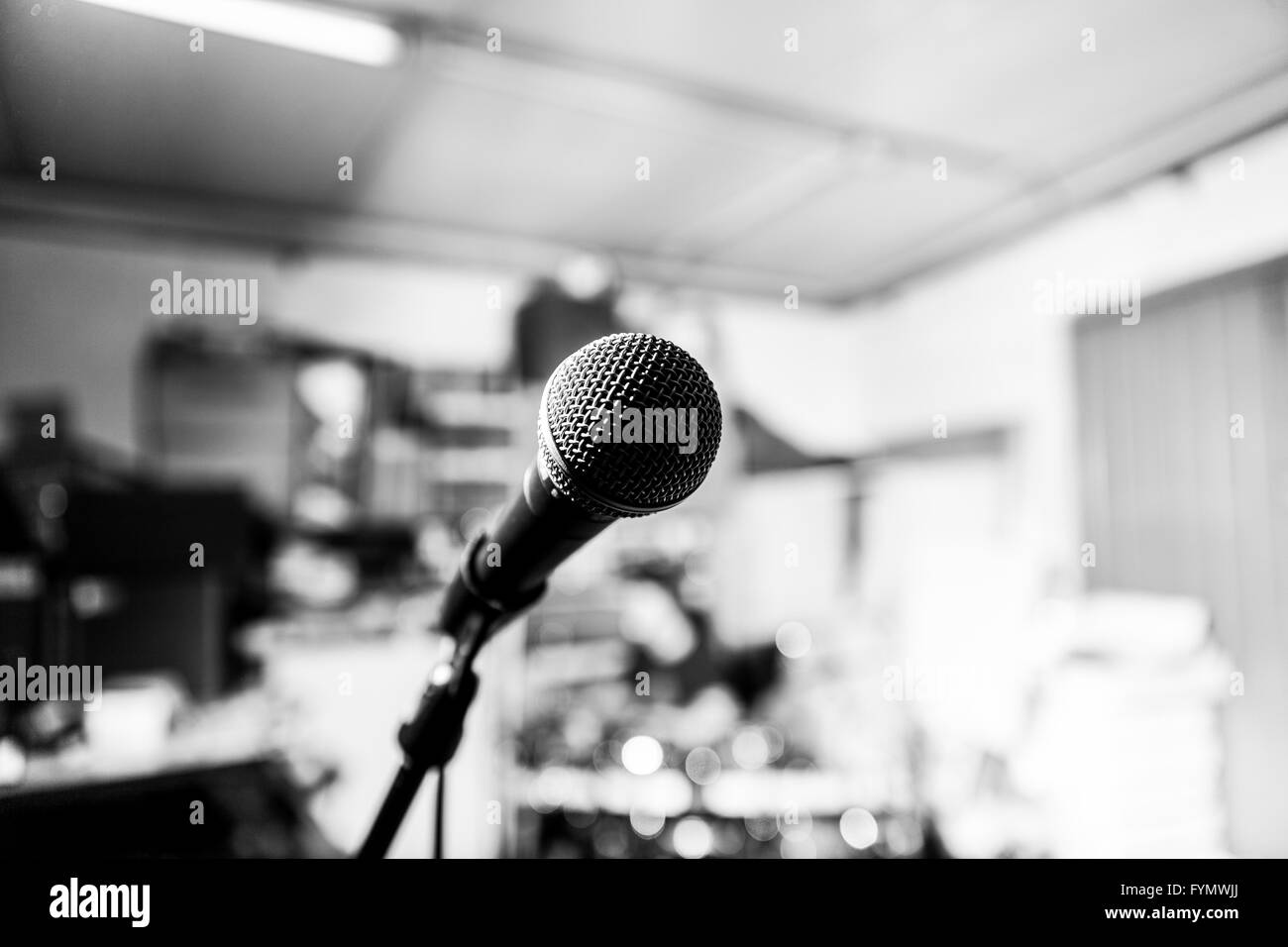 high contrast black and white close up of a microphone on a band ...