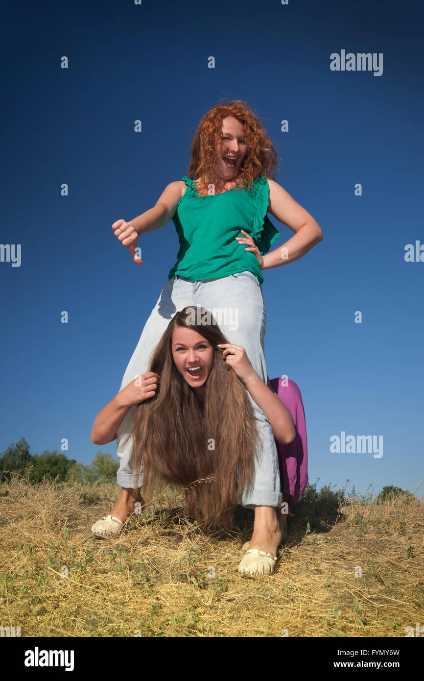 Two women have fun in park Stock Photo - Alamy