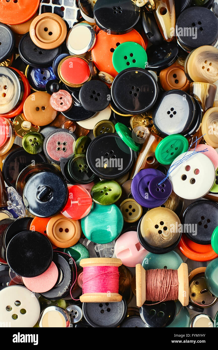Set of various sewing buttons and thread.Top view Stock Photo - Alamy