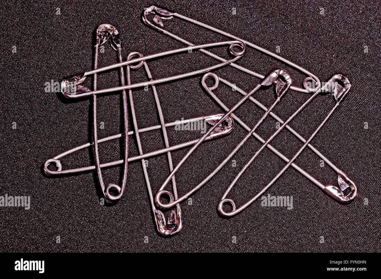 Safety pins hi-res stock photography and images - Alamy