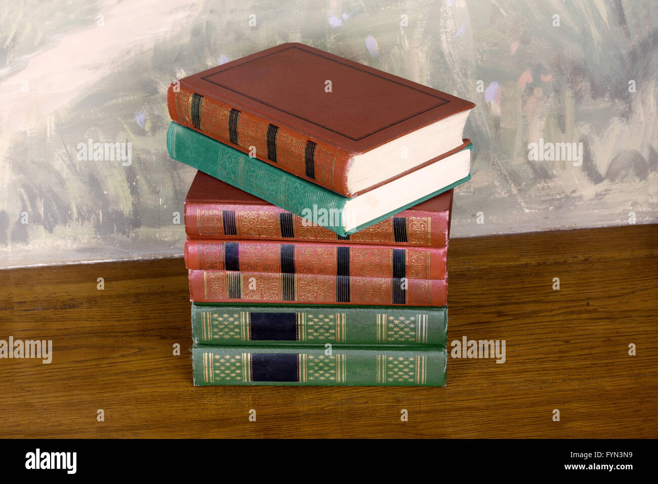 Richly decorated volumes of books with gold lettering Stock Photo - Alamy