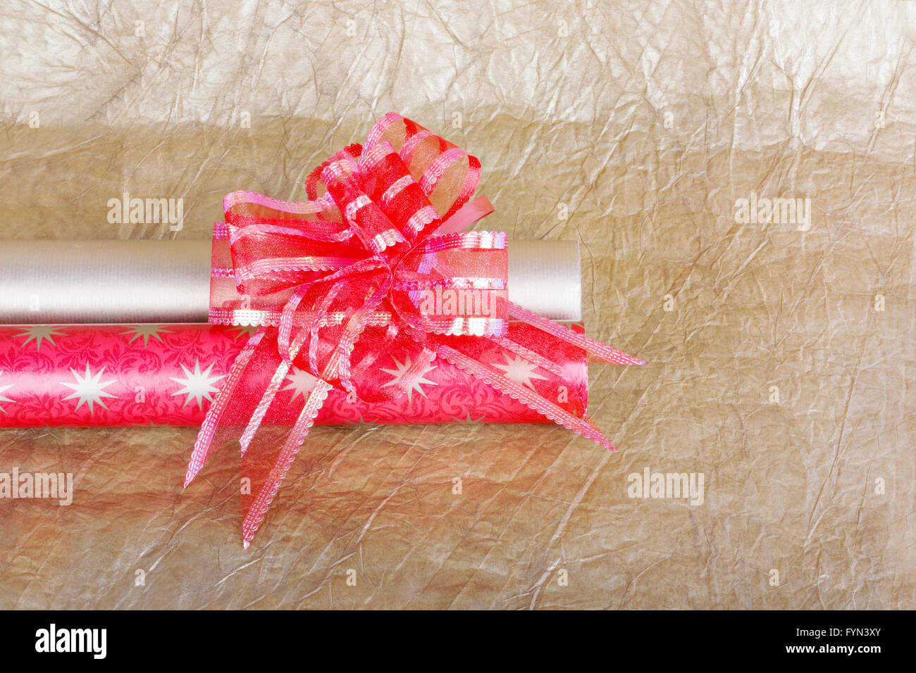 Beautiful red bow for gift decoration on gold background Stock Photo ...