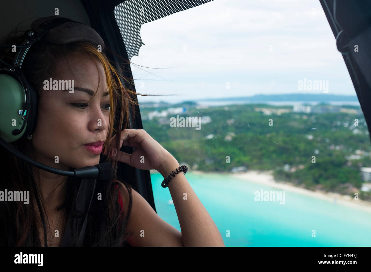 Beautiful Asian girl in a helicopter over Boracay, Philippines Stock ...