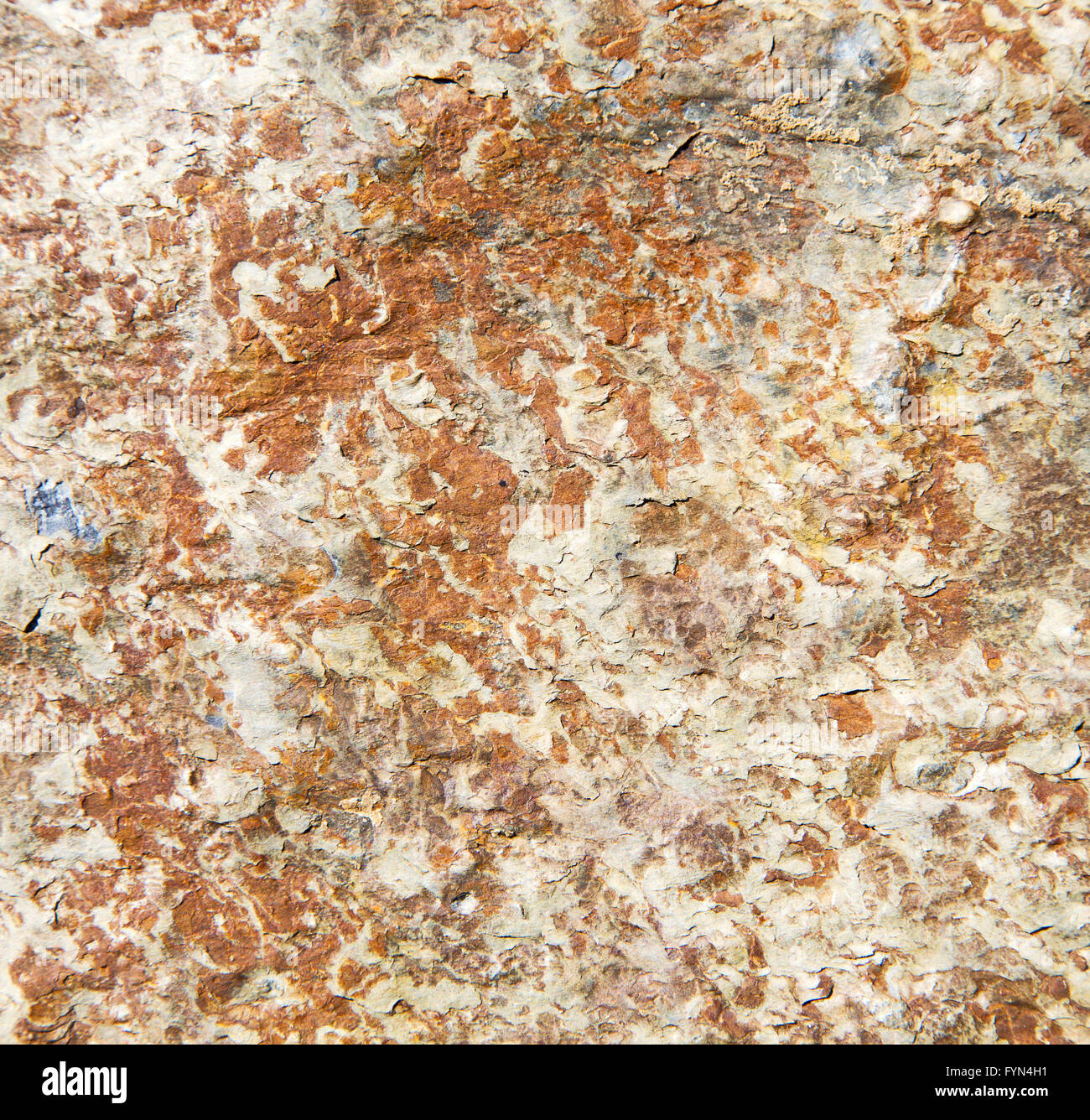 rocks stone and red orange gneiss in the wall of morocco Stock Photo ...