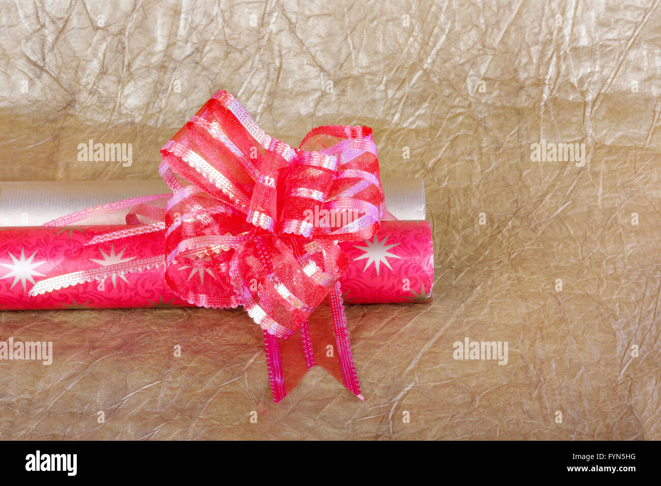 Beautiful red bow for gift decoration on gold background Stock Photo ...