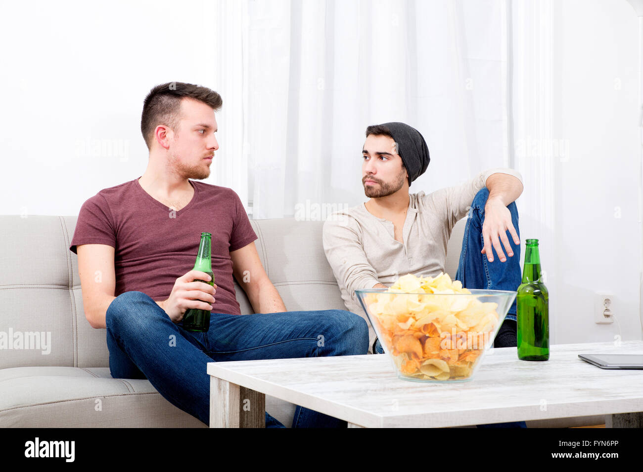 Two Friends having a conversation in the living room Stock Photo - Alamy