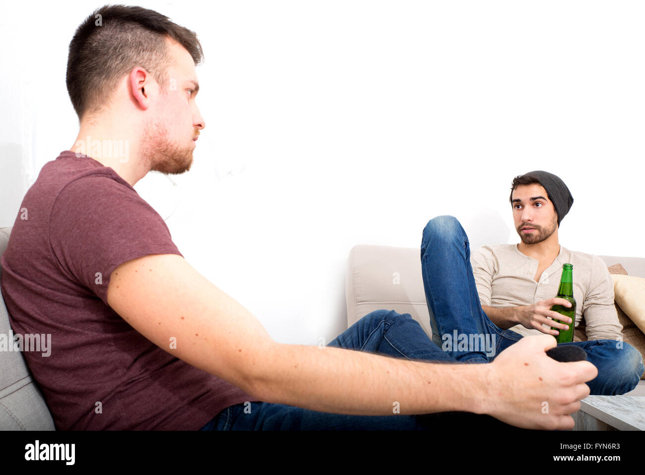 Two Friends having a conversation in the living room Stock Photo - Alamy