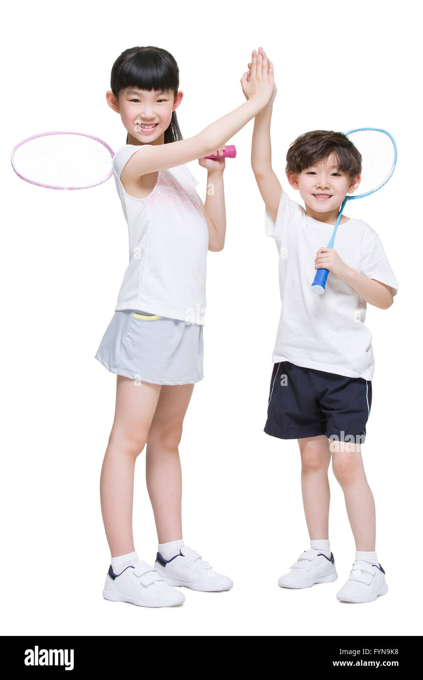 Cute children playing badminton Stock Photo - Alamy
