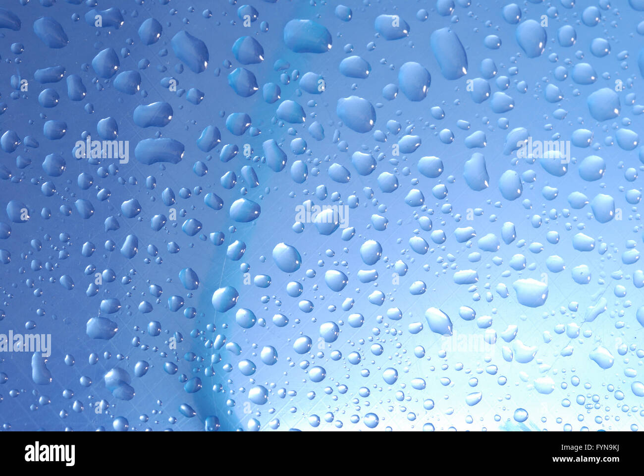 water drops on blue background Stock Photo - Alamy