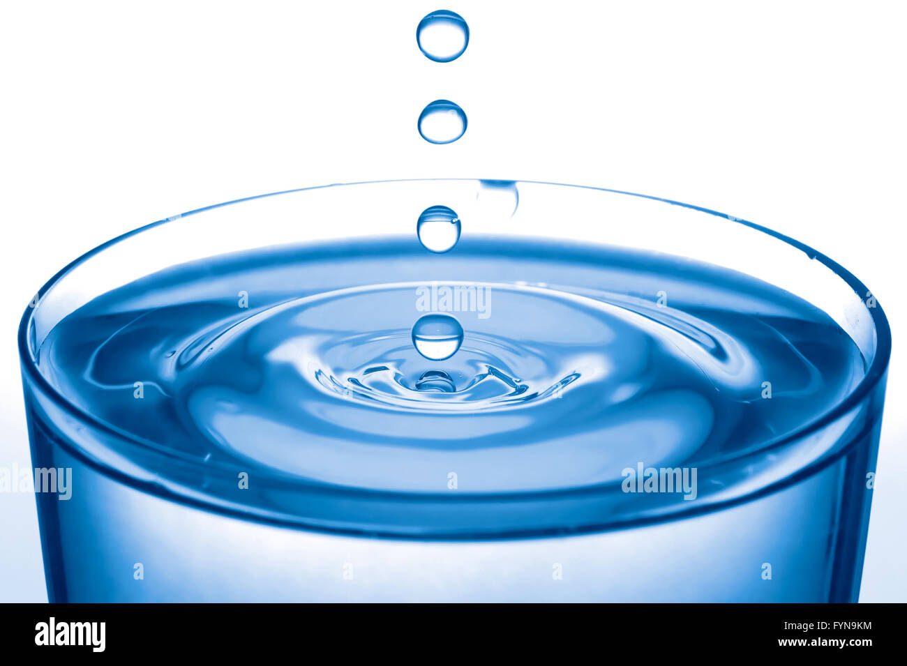 drops falling down into a glass Stock Photo - Alamy
