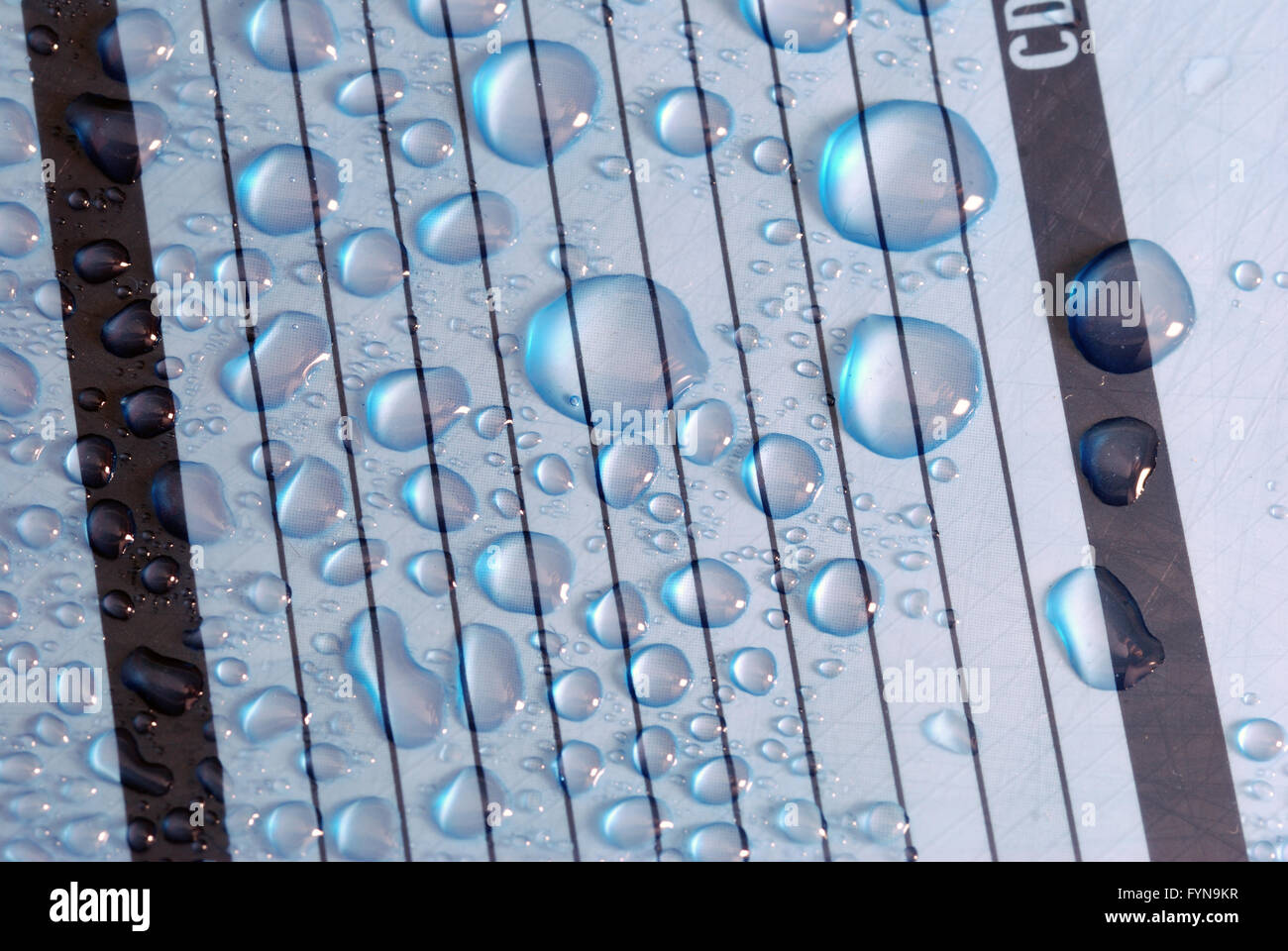 water drops on cd cover background Stock Photo - Alamy