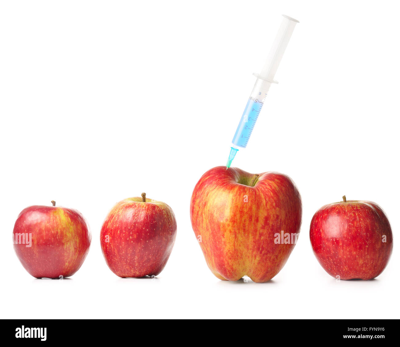 small apples and a big one with syringe Stock Photo - Alamy