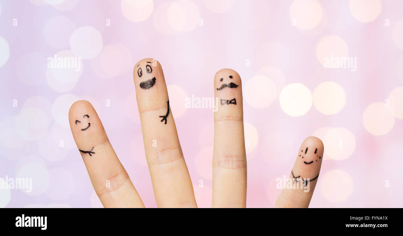 close up of four fingers with smiley faces Stock Photo - Alamy