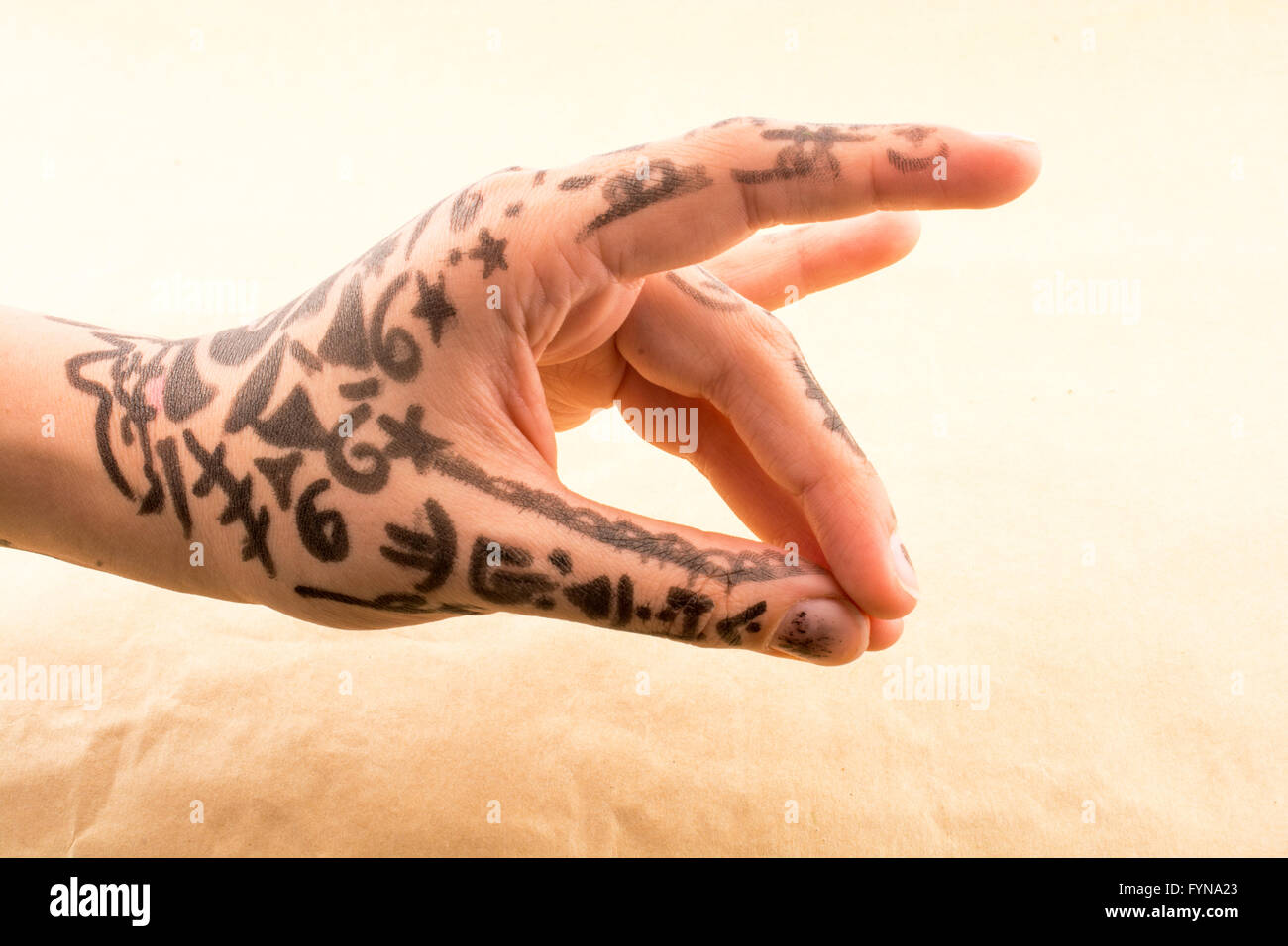 Hand with tattoo on a background Stock Photo - Alamy