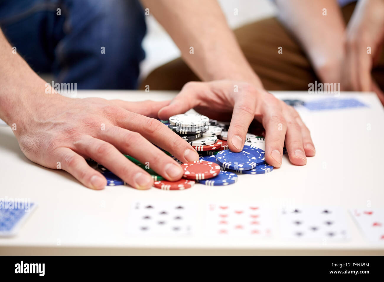 hands with casino chips making bet or taking win Stock Photo - Alamy
