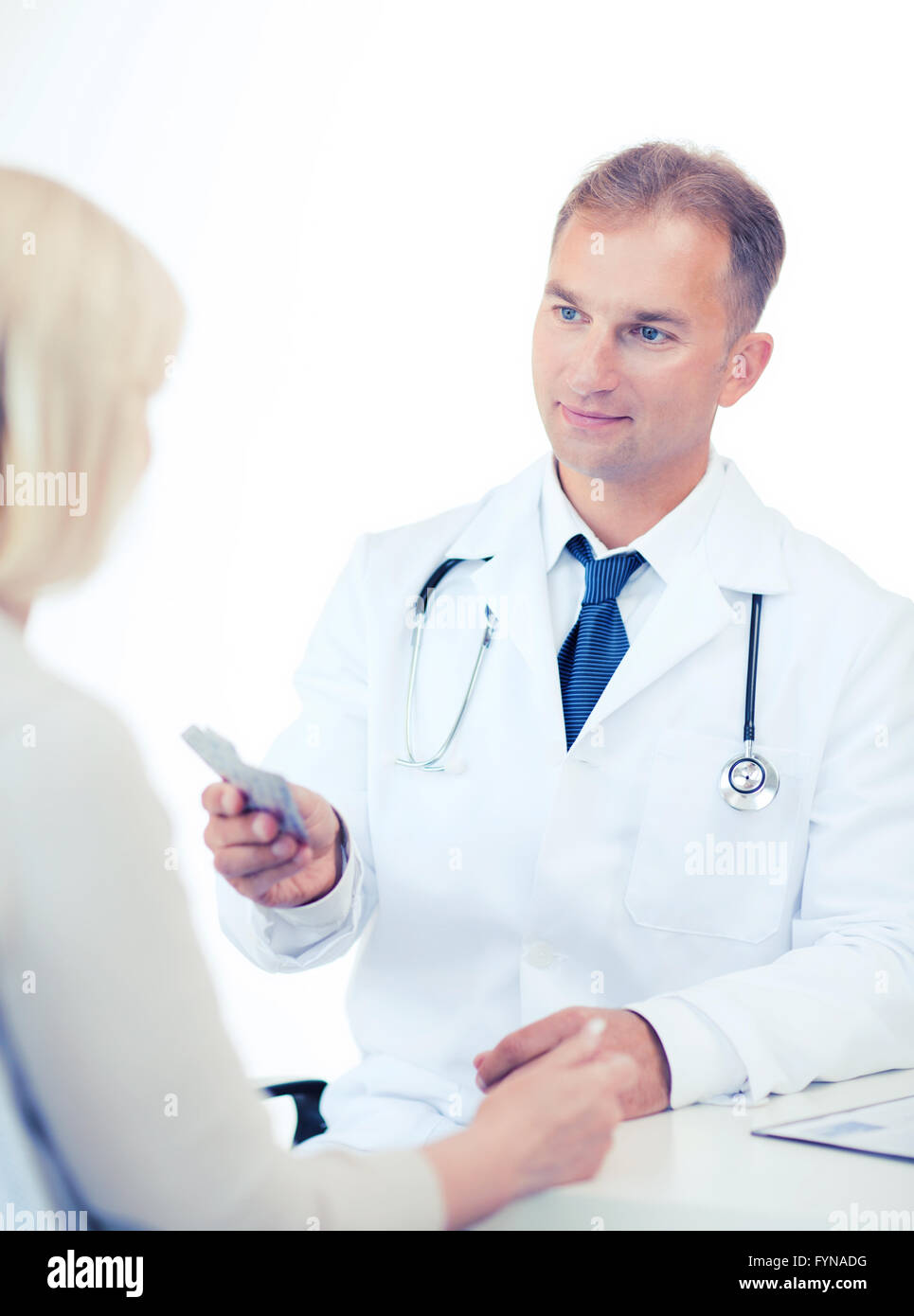 doctor giving tablets to patient in hospital Stock Photo - Alamy