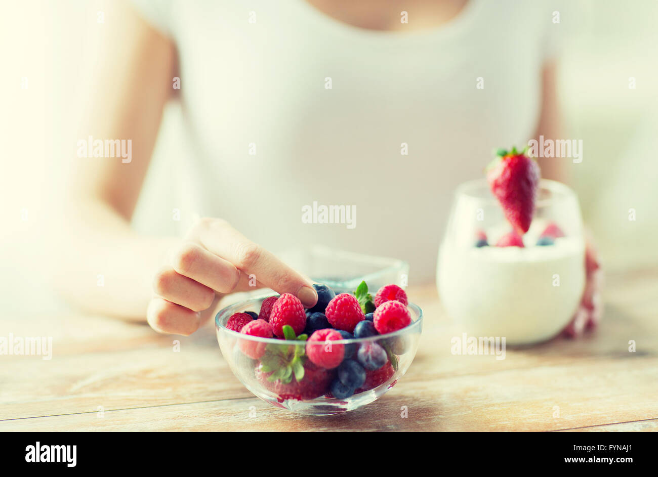 close up of woman hands with yogurt and berries Stock Photo - Alamy
