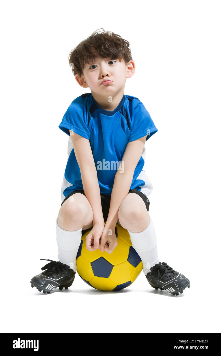 Cute boy and soccer ball Stock Photo - Alamy