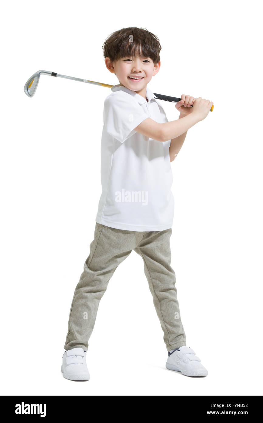 Cute boy playing golf Stock Photo - Alamy